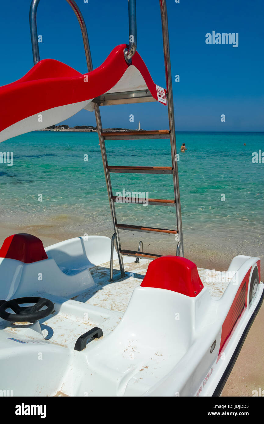 Colorful pedal-boats with water slides on the beach Stock Photo - Alamy