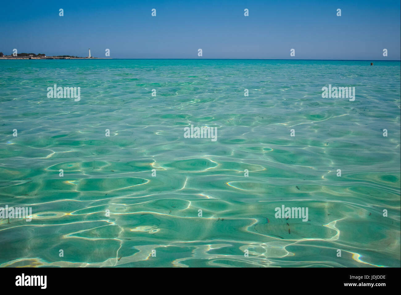 Crystal clear sea water texture with glare from the sun Stock Photo - Alamy