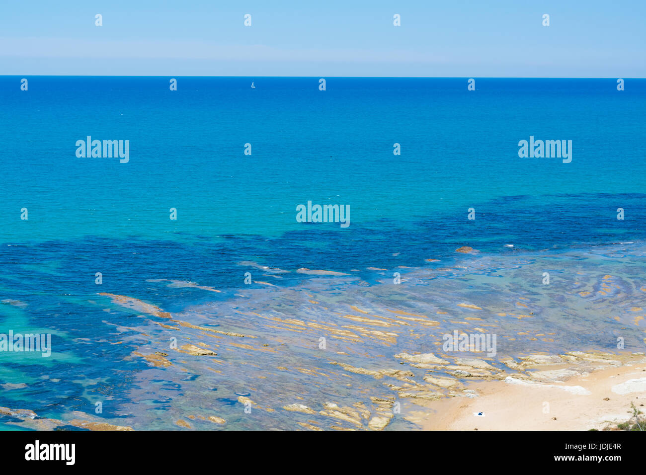 Crystal clear sea water texture with glare from the sun Stock Photo - Alamy