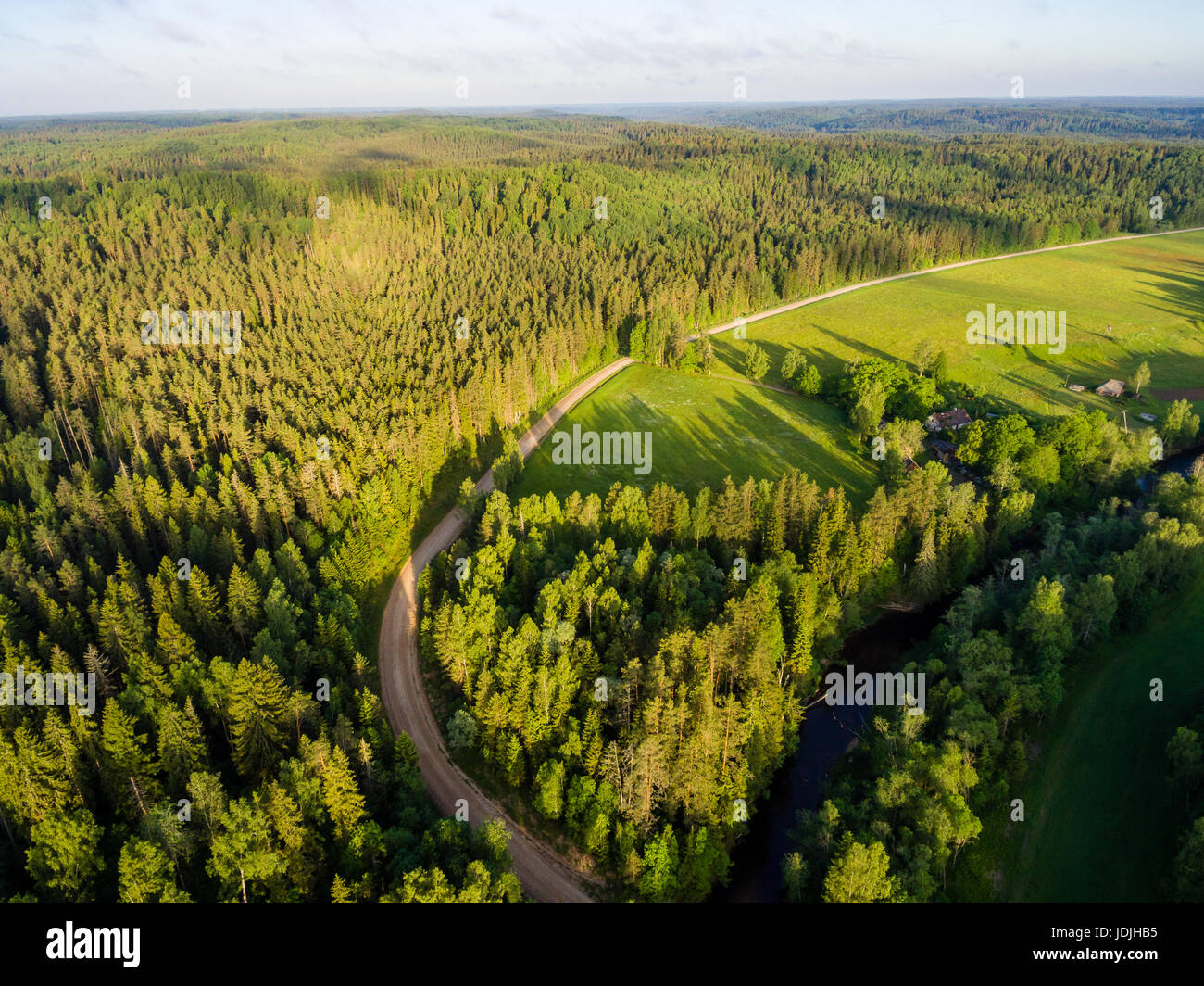 drone image. aerial view of rural area with forest river in summer ...