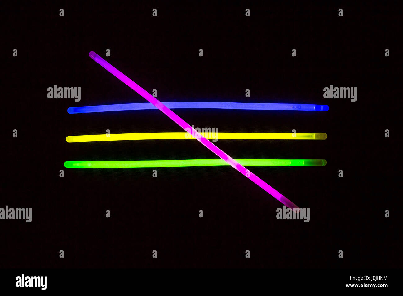 Glow sticks neon light fluorescent on back background. variation of ...