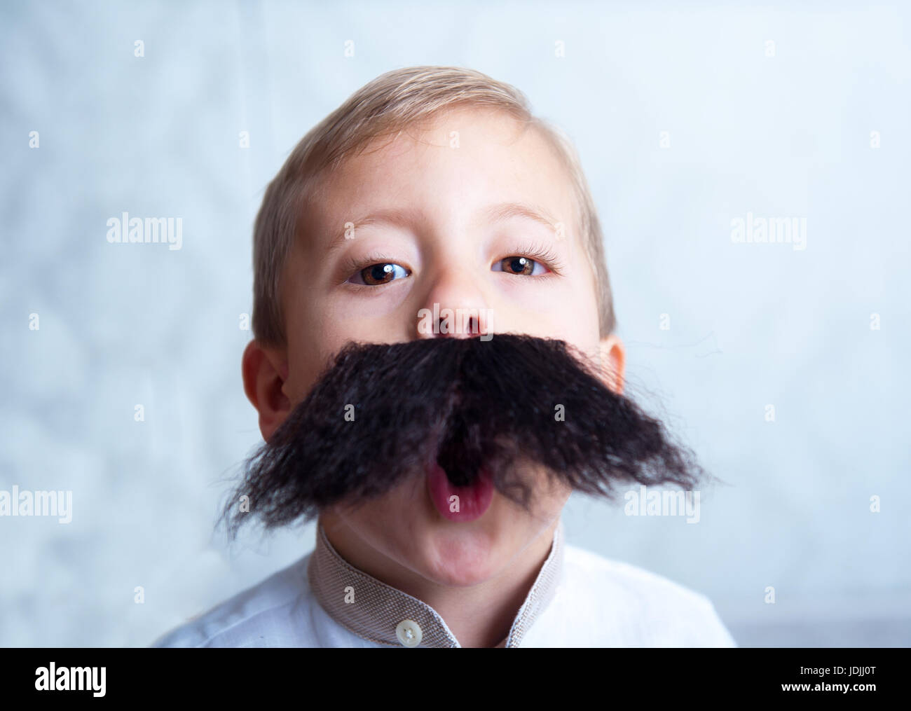 A little boy with a mustache Stock Photo - Alamy