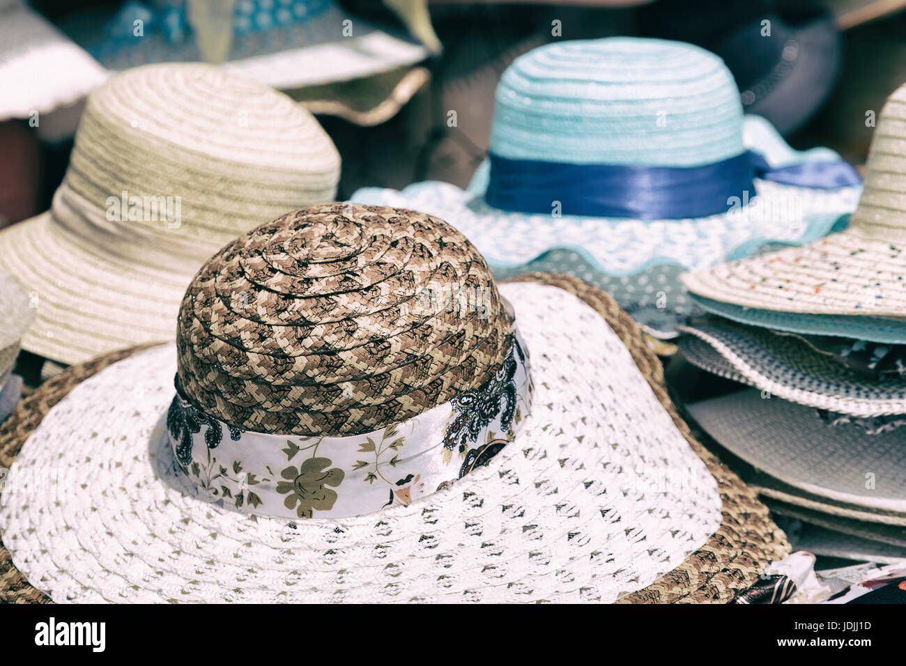 in a old market lots of colorated hats like background clothes Stock ...