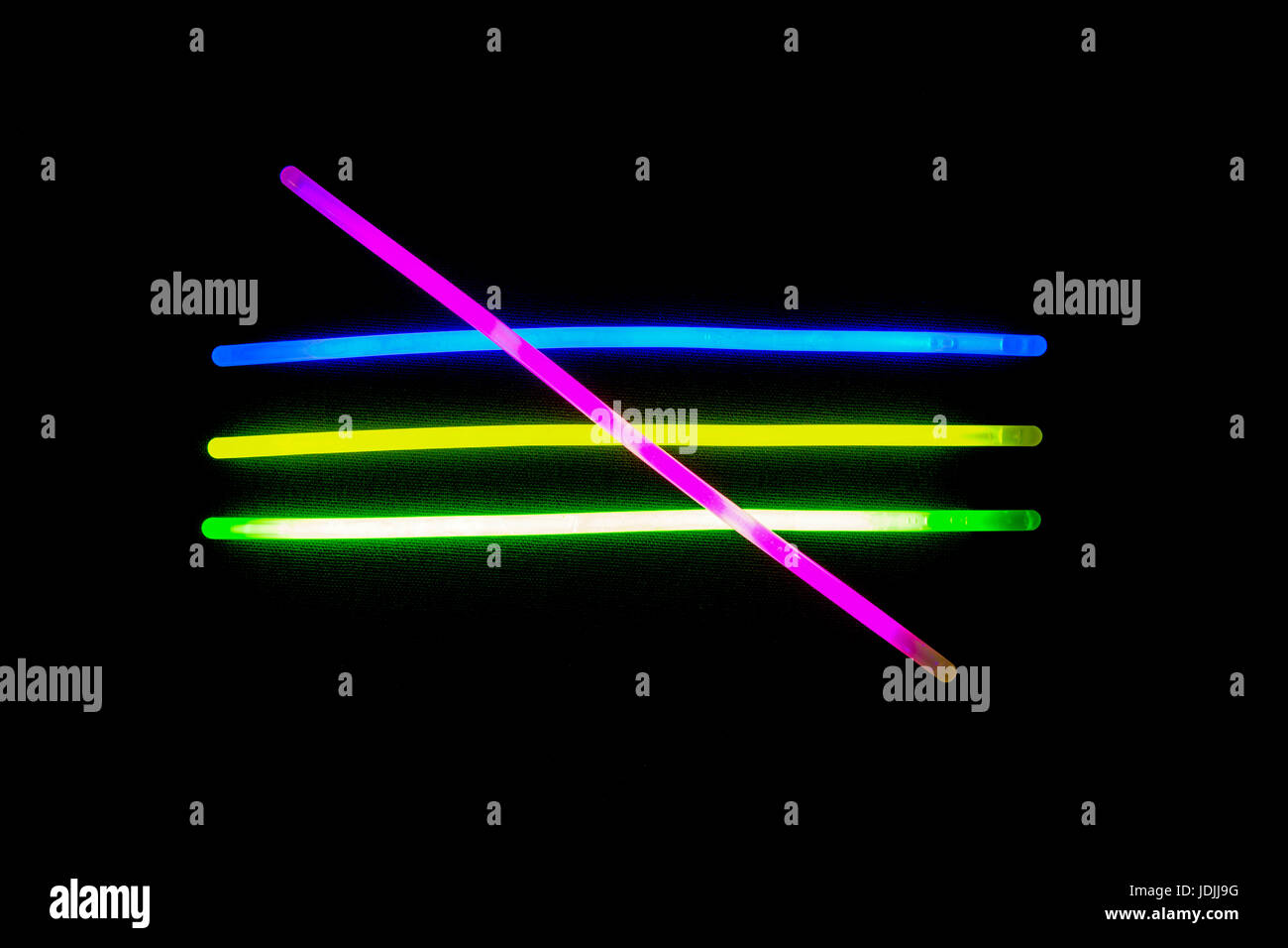 Glow sticks neon light fluorescent on back background. variation of ...