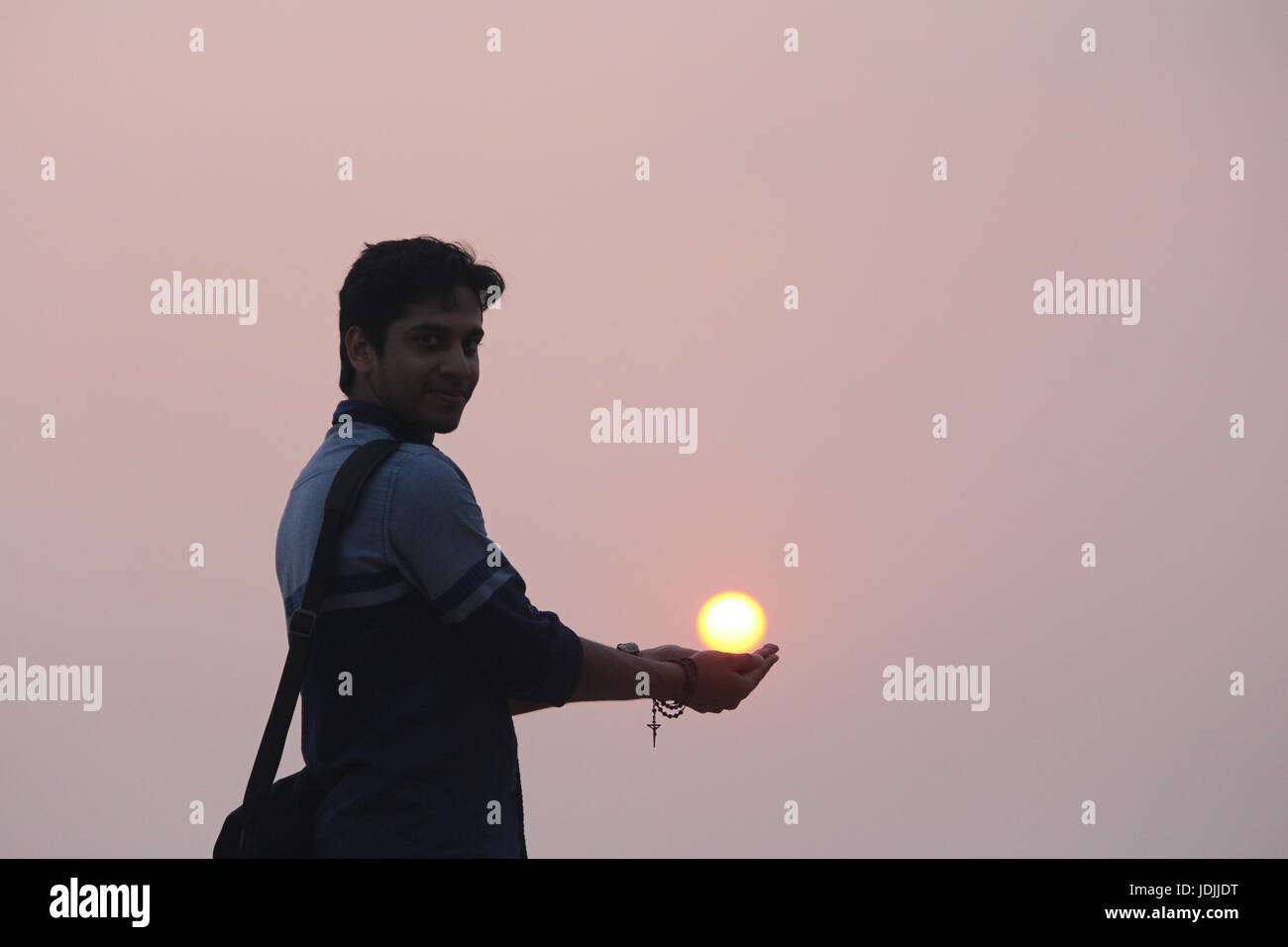 sun in hand Stock Photo - Alamy