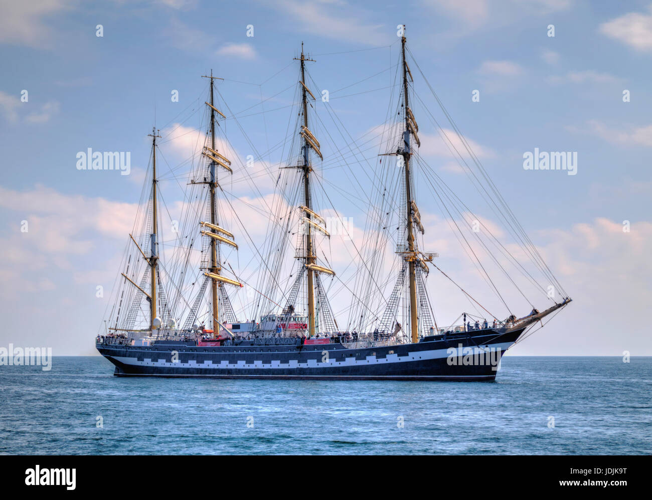Sailing ship in the blue sea Stock Photo - Alamy