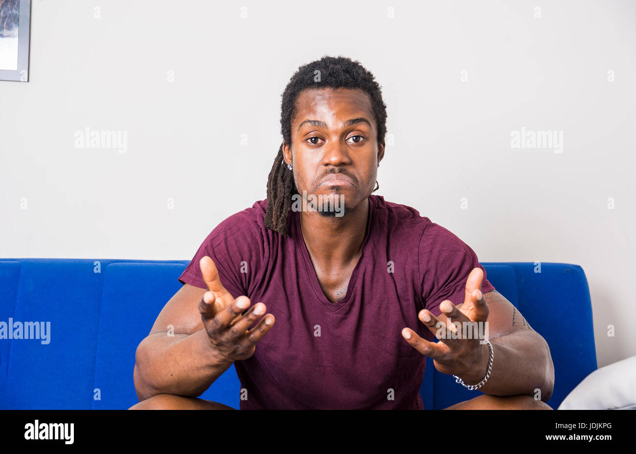 Handsome unsure, doubtful black man thinking, looking up with dubious ...