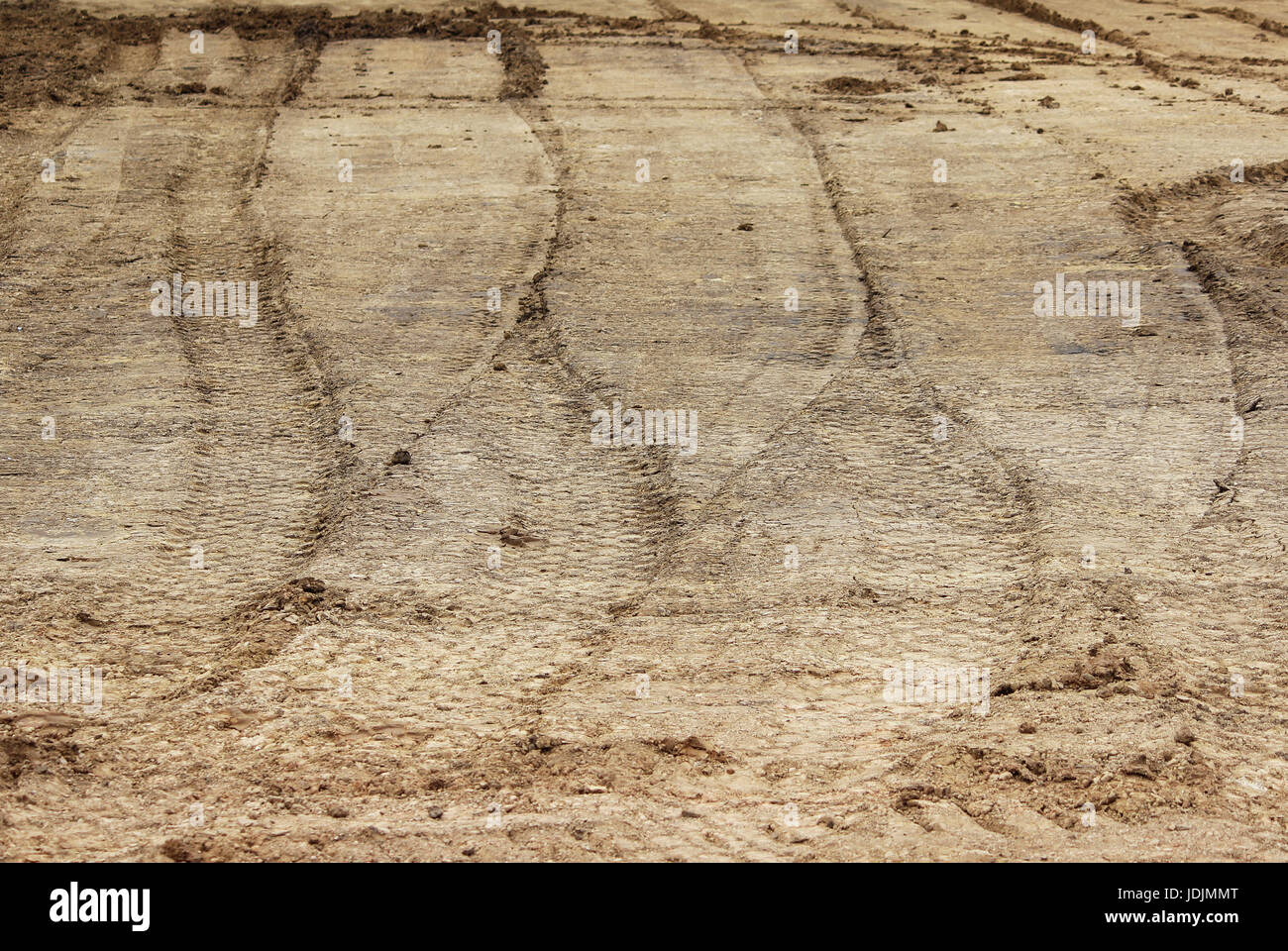 Wheel tracks in the mud, detail footprints asphalt compactor in the ...