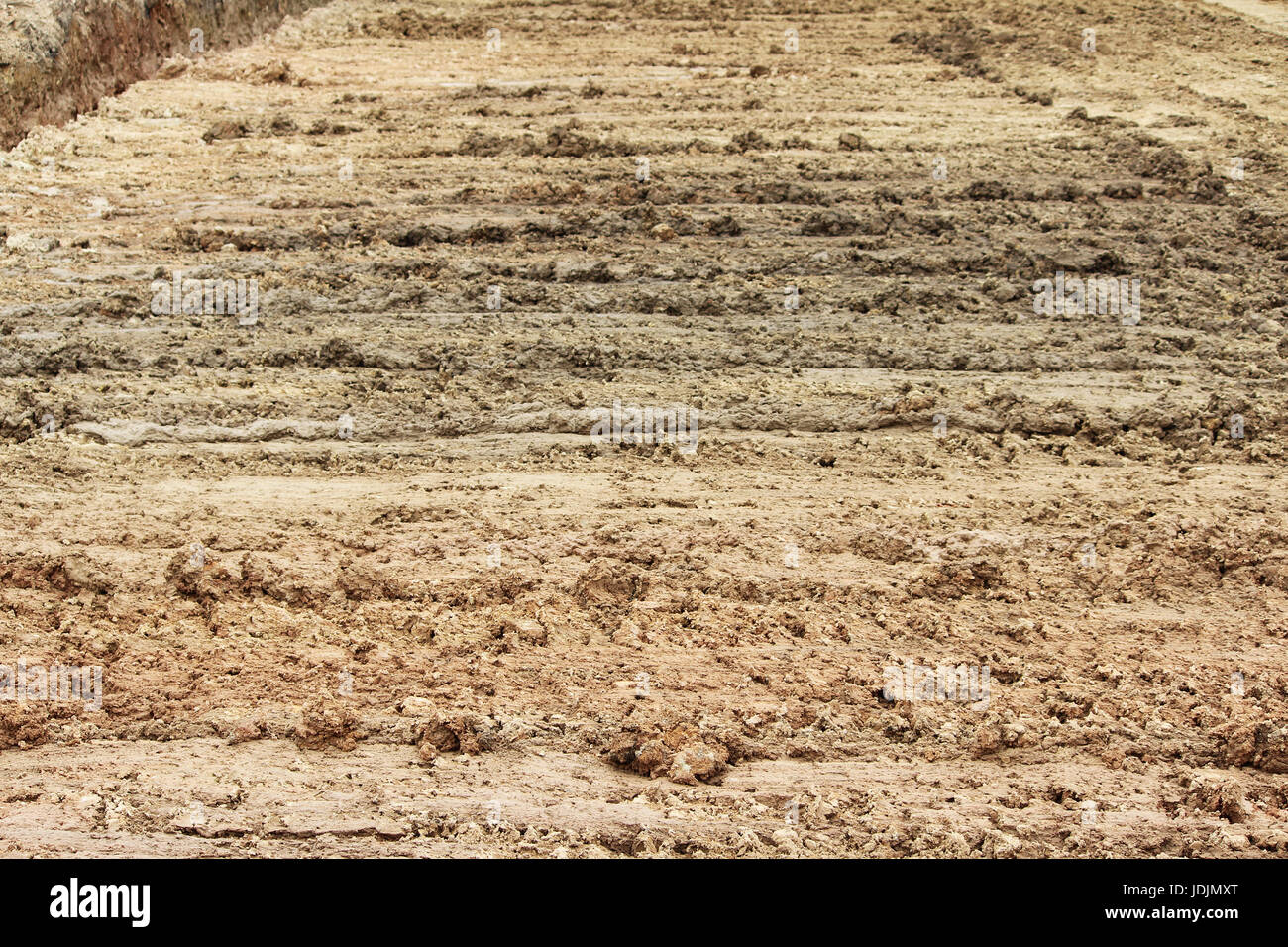 Wheel tracks in the mud, detail footprints bulldozer in the ...