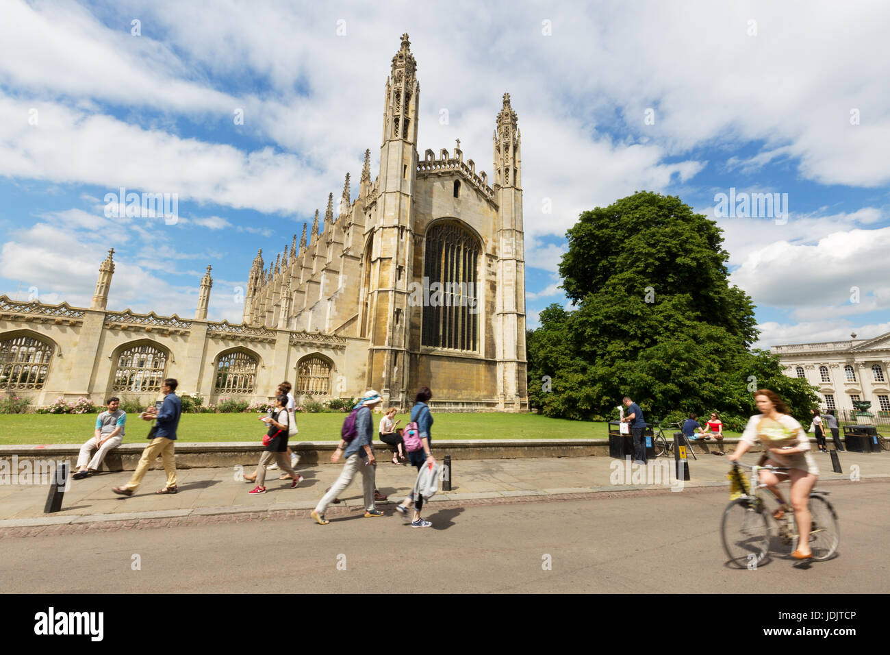 Student on a bicycle; Kings College Chapel, Kings Parade Cambridge city ...
