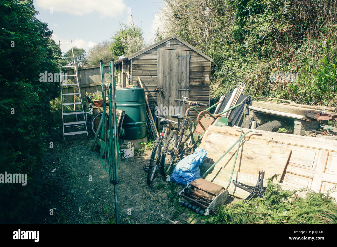 untidy overgrown garden back yard Stock Photo - Alamy