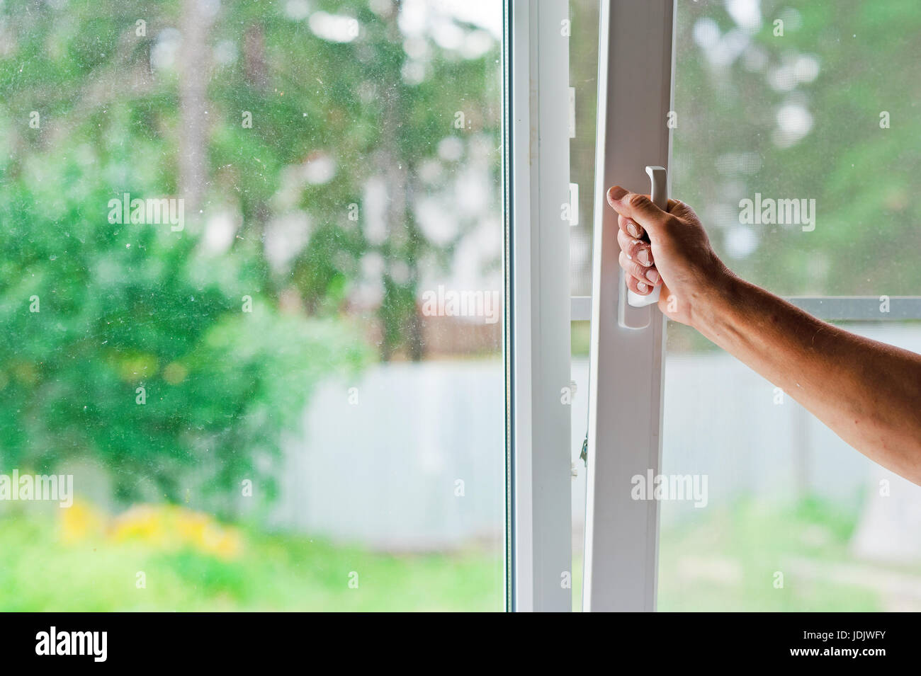 man opens a window Stock Photo - Alamy