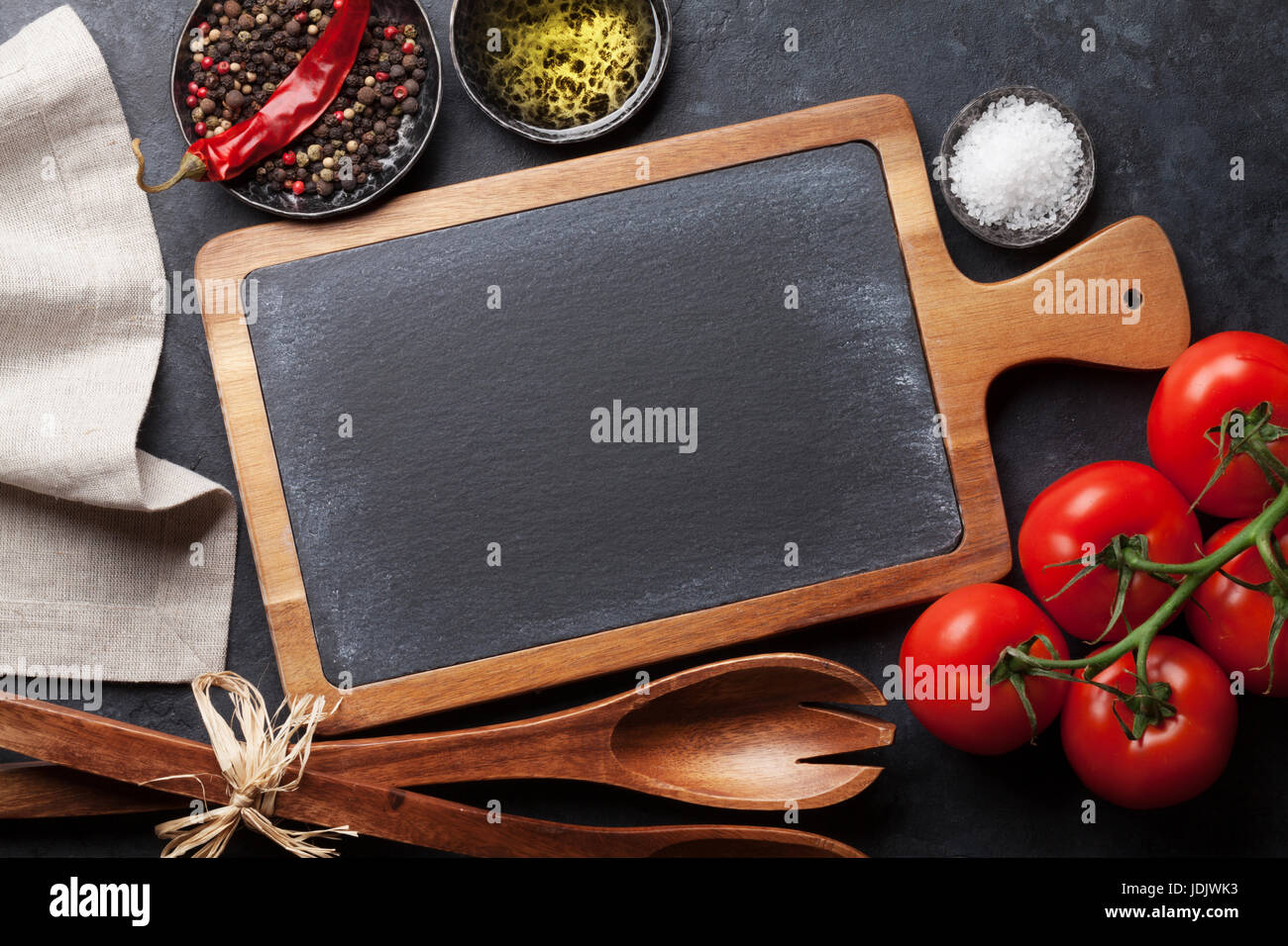 Cooking ingredients and utensils on stone table. Top view with ...