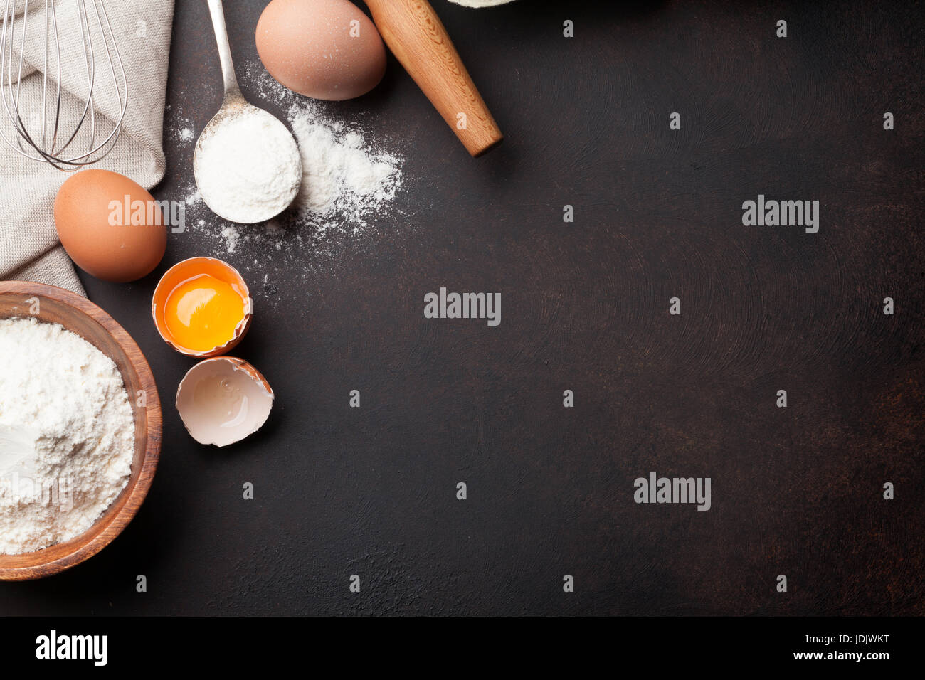 Pasta cooking ingredients on wooden kitchen table. Top view with space ...