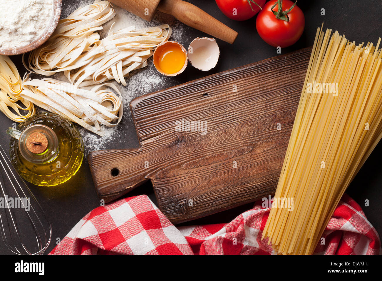 Pasta cooking ingredients on wooden kitchen table. Top view Stock Photo ...