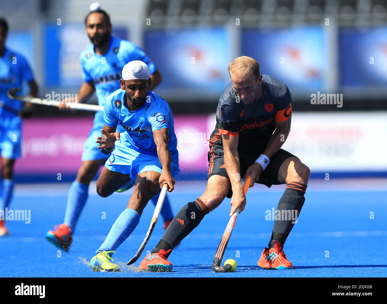 India's Mandeep Singh (left) and Netherlands Billy Bakker battle for ...