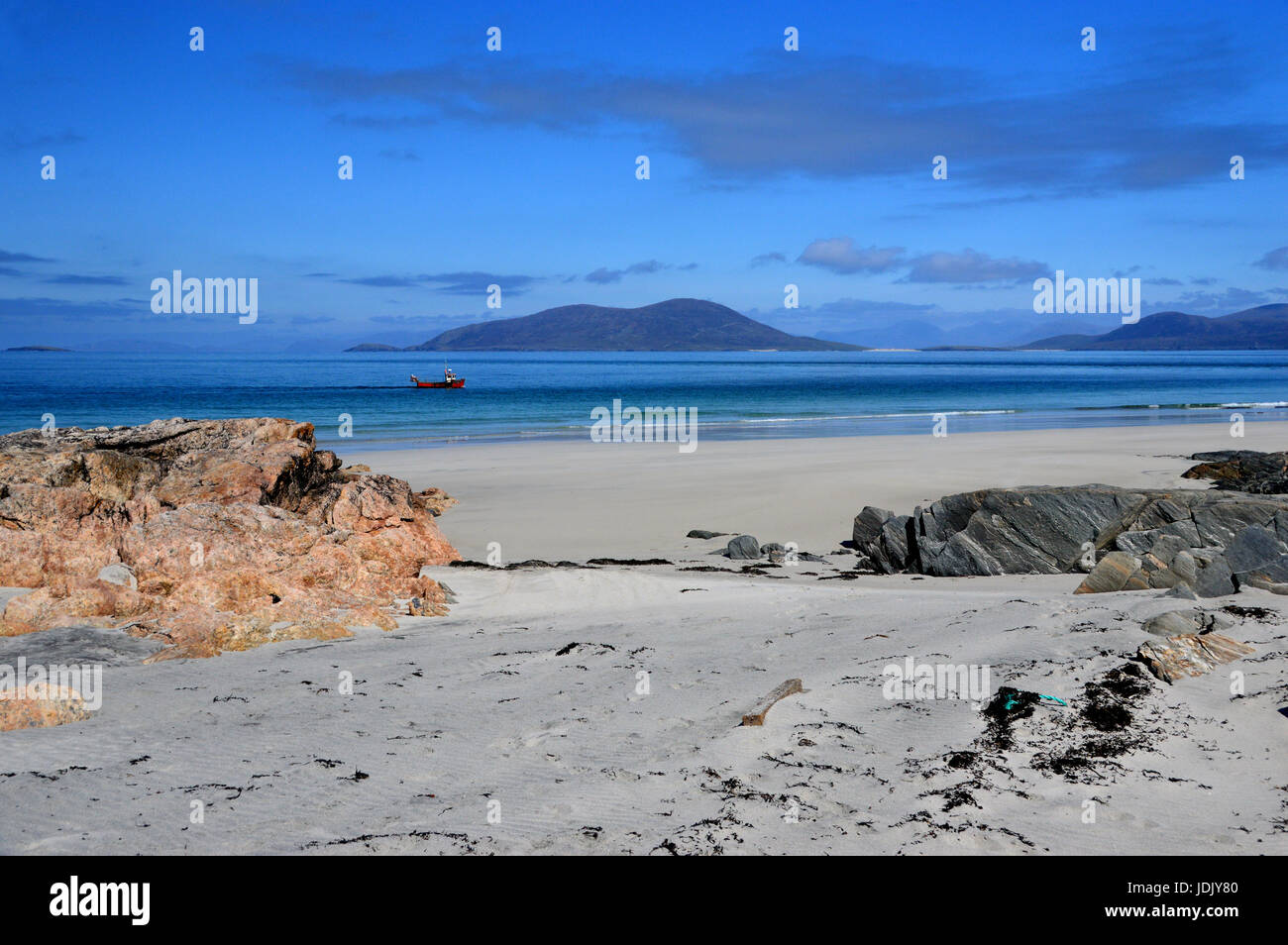 A Little Red Fishing Boat Sailing on the Sound of Harris Below ...