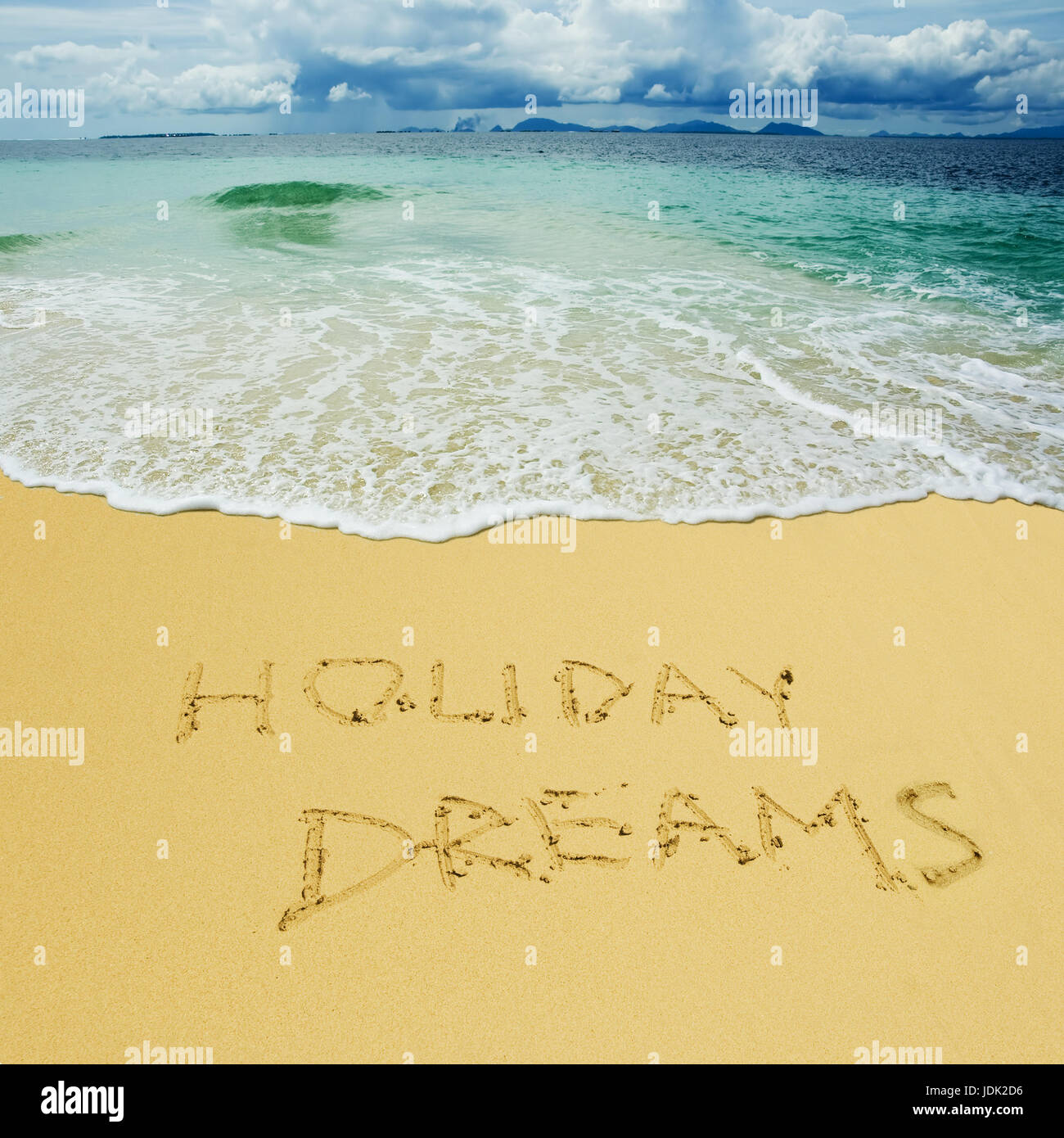 holiday dreams written in a sandy tropical beach Stock Photo - Alamy