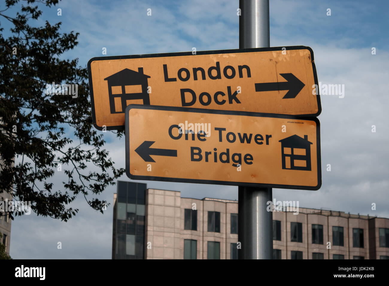 A street sign pointing directions to Tower Bridge and London Dock Stock ...