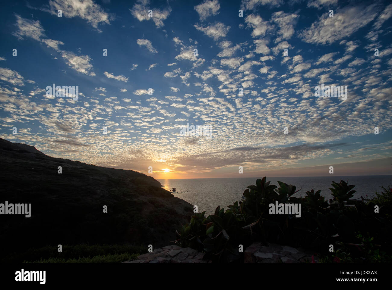 Mackerel sky over sea hi-res stock photography and images - Alamy