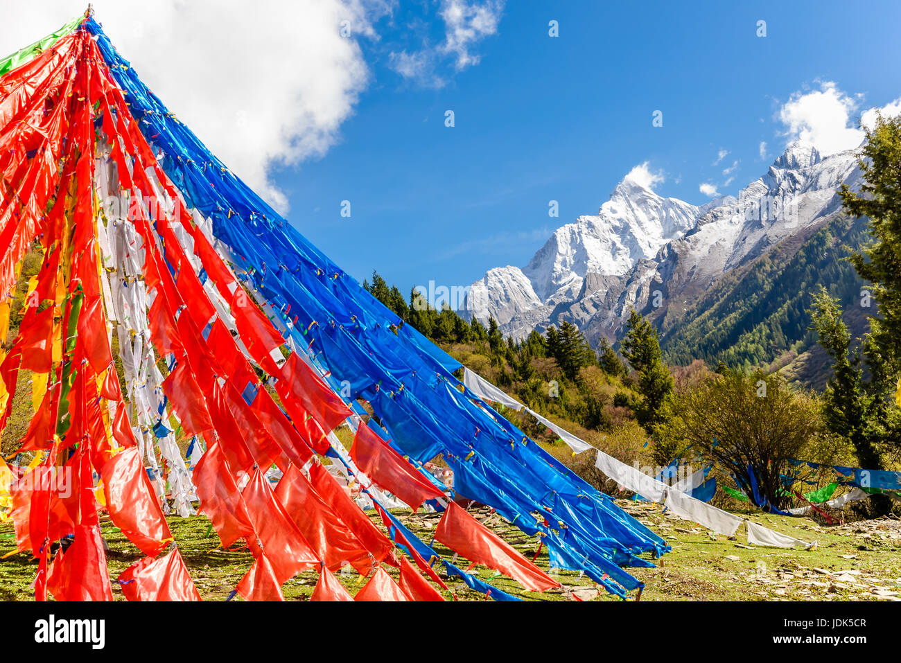 View on prayer flags before Siguniang mountain in Sichuan Province ...