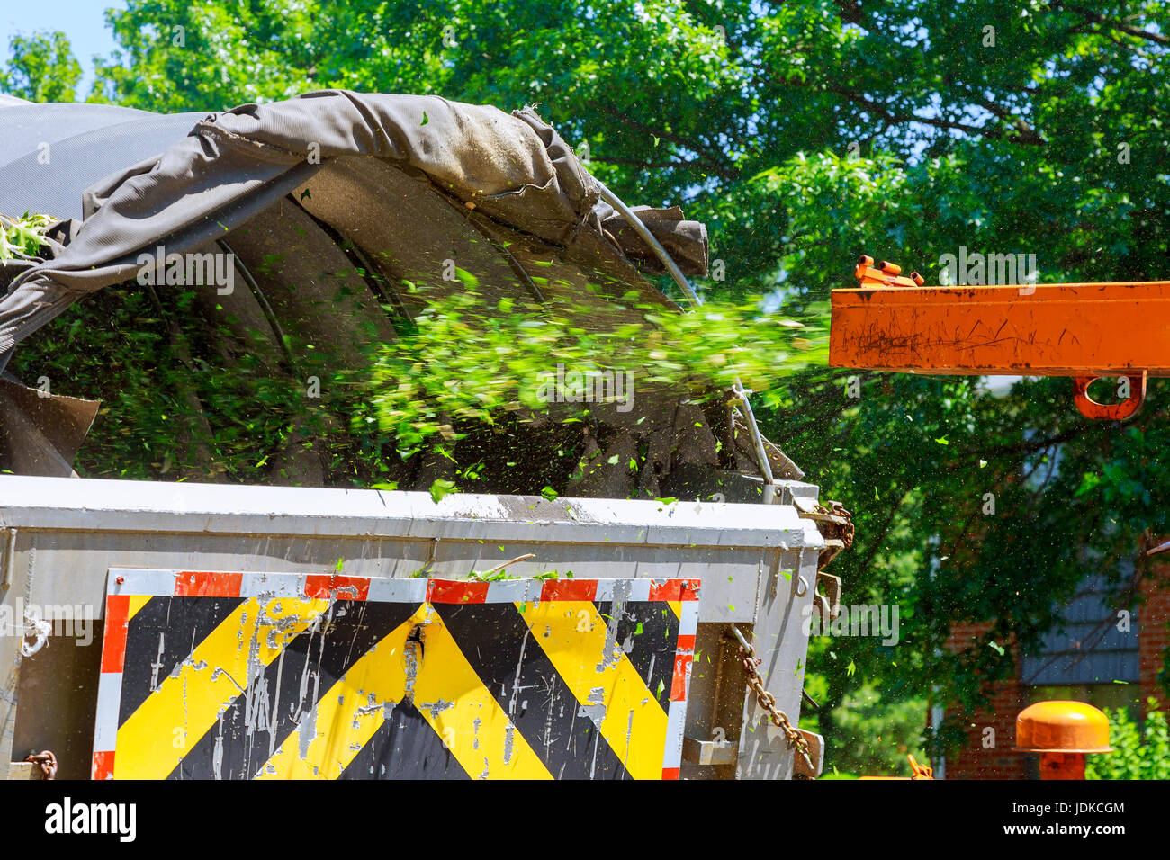 Wood Chipper in Action captures a wood chipper or mulcher shooting ...