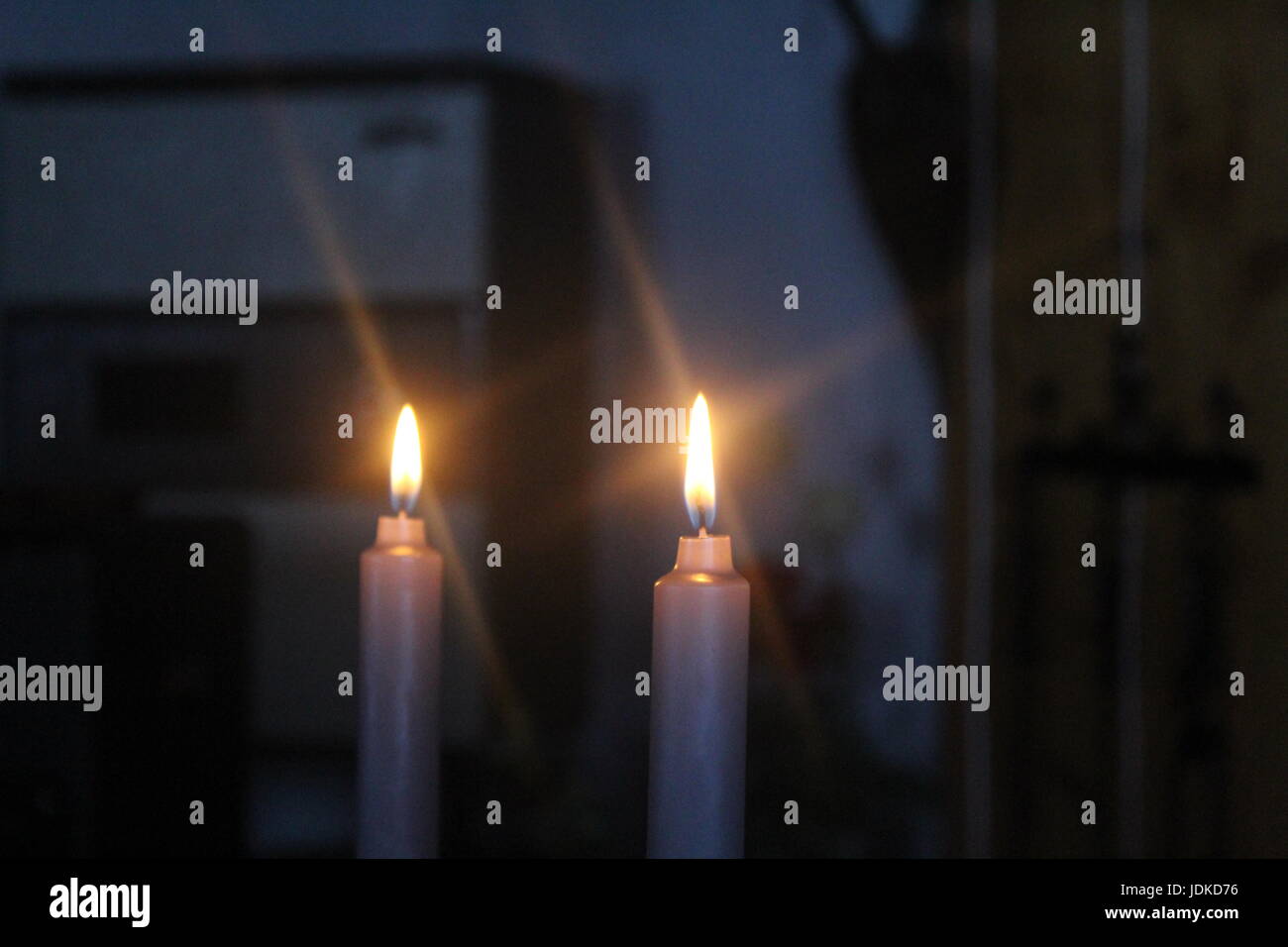 Two Glowing Candles Stock Photo - Alamy
