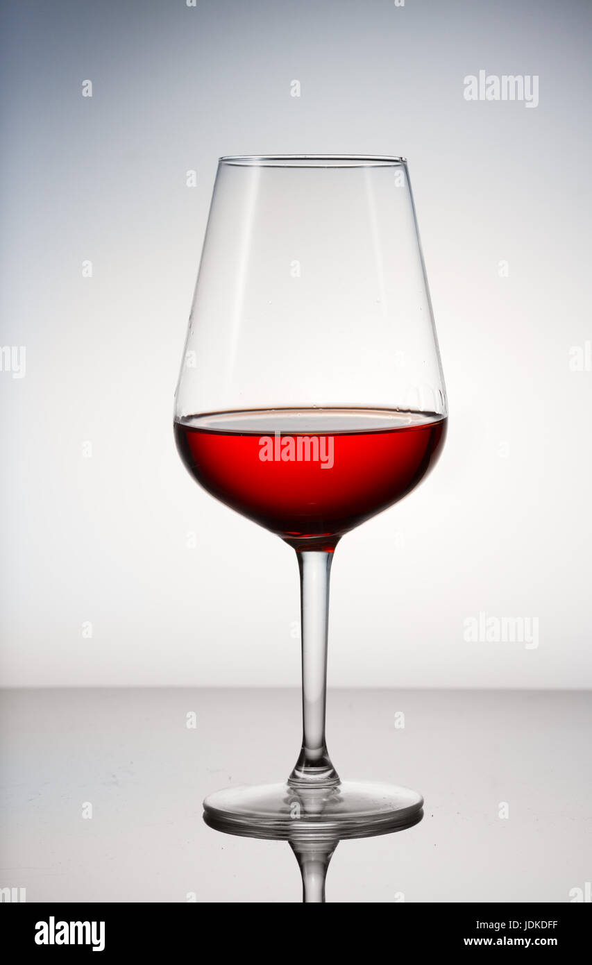 High glass with still red wine Stock Photo - Alamy