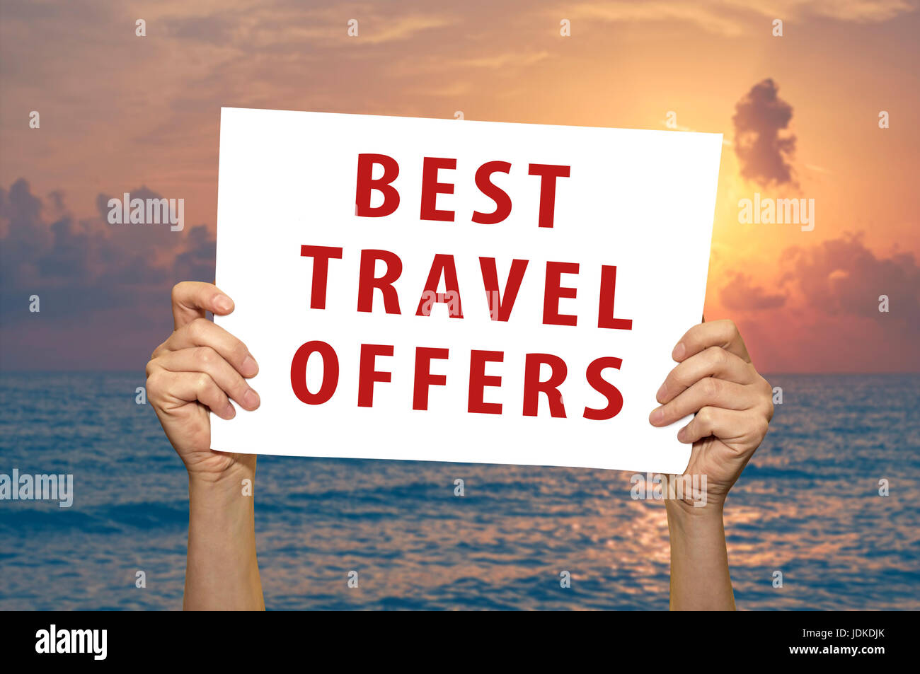 Best Travel Offers card in hand with a sea on background Stock Photo ...