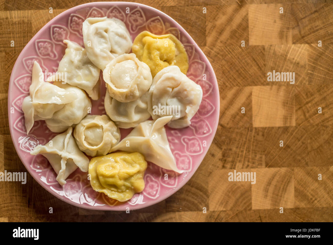 Variety of dumplings with different filling on a plate Stock Photo - Alamy