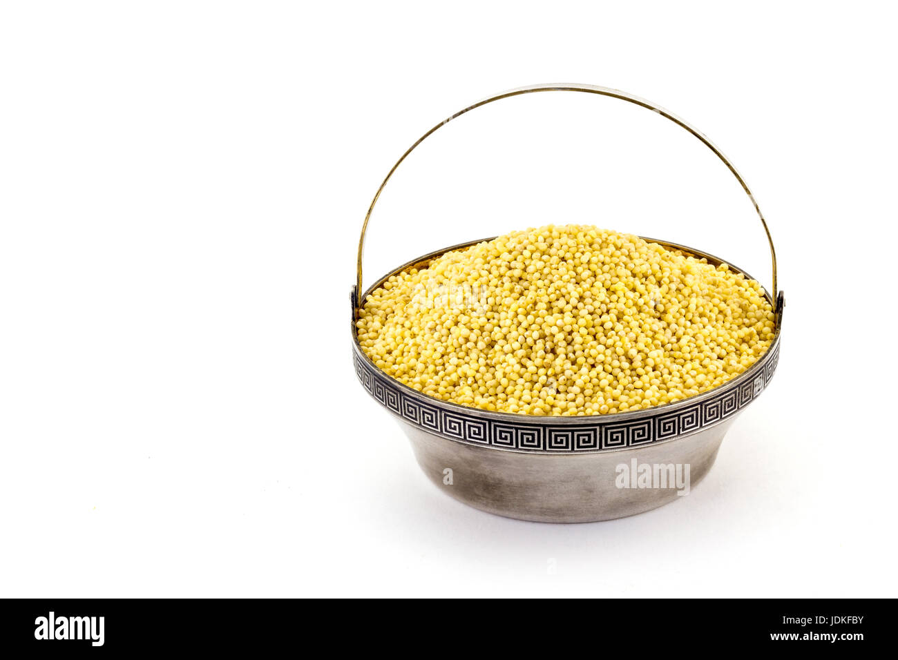 Dry raw Millet in rare silver pial isolated on white background Stock ...