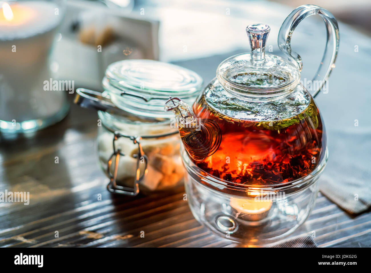 Close-up of modern glass teapot with tea inside in cafe Stock Photo - Alamy