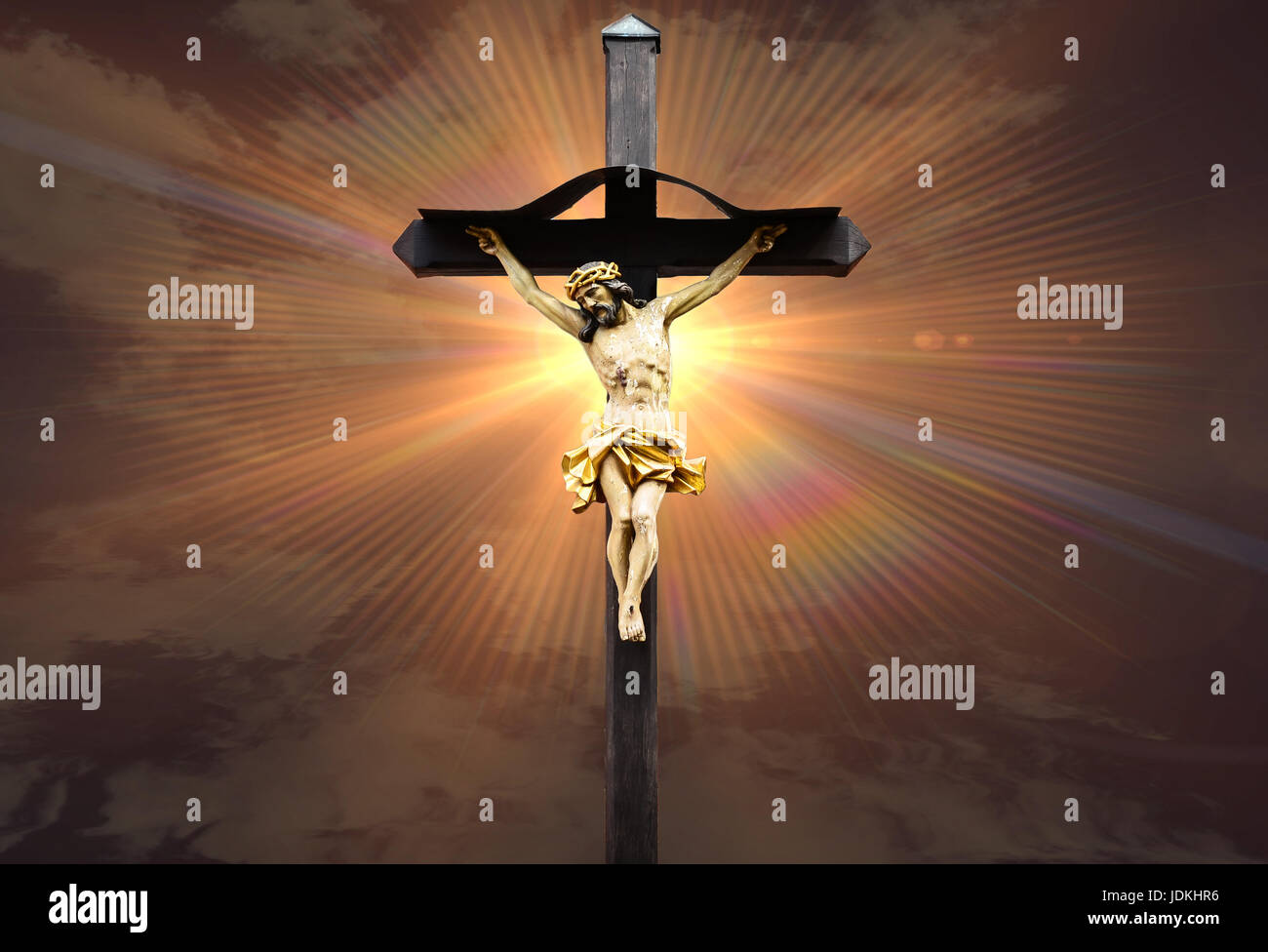 Jesus Christ statue against color backgrounds Stock Photo - Alamy