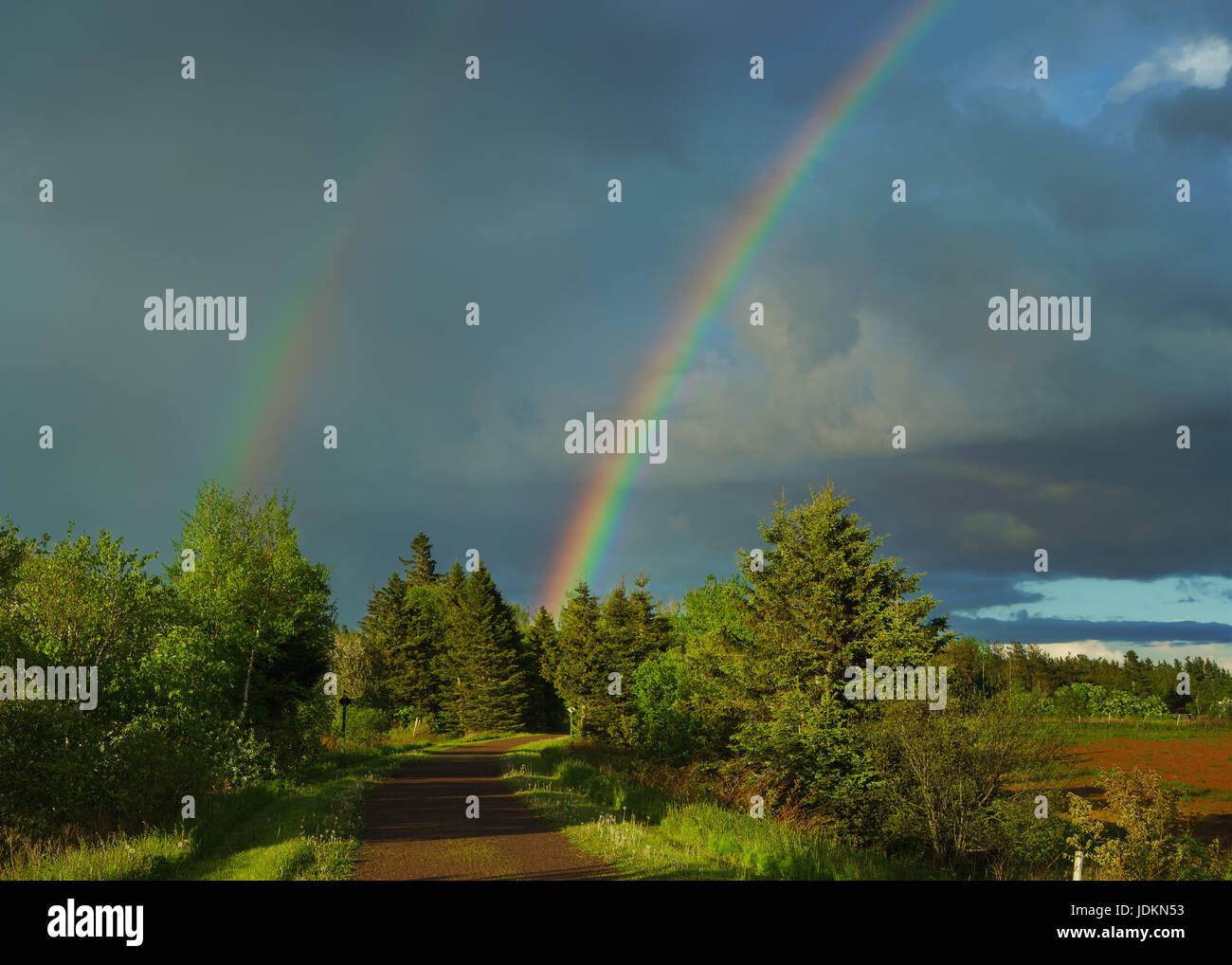A rainbow over the Trans Canada Trail or the Confederation trail in ...