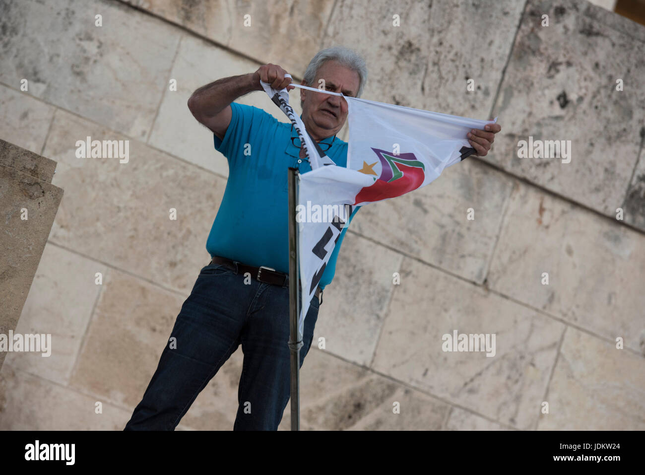 Tearing flag hi-res stock photography and images - Alamy
