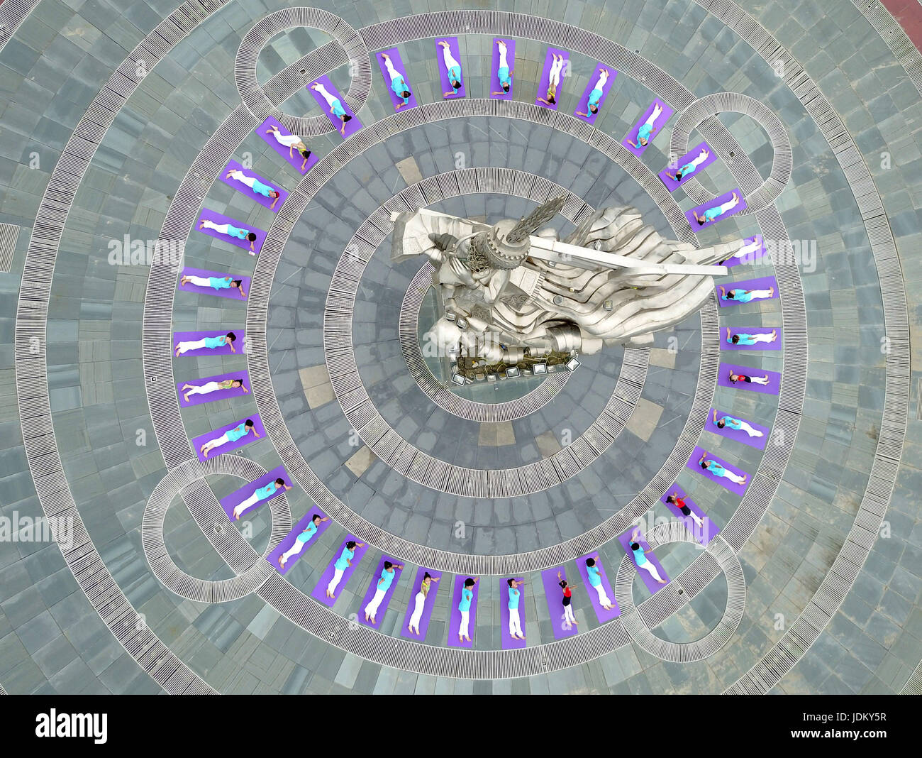 Jianhe, China's Guizhou Province. 20th June, 2017. Yoga fans practise ...