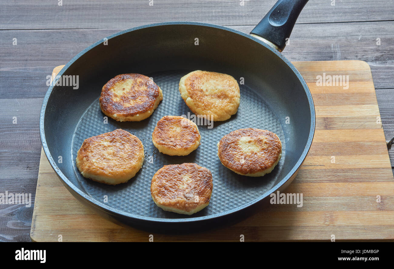 Frying cottage cheese pancakes in hi-res stock photography and images ...
