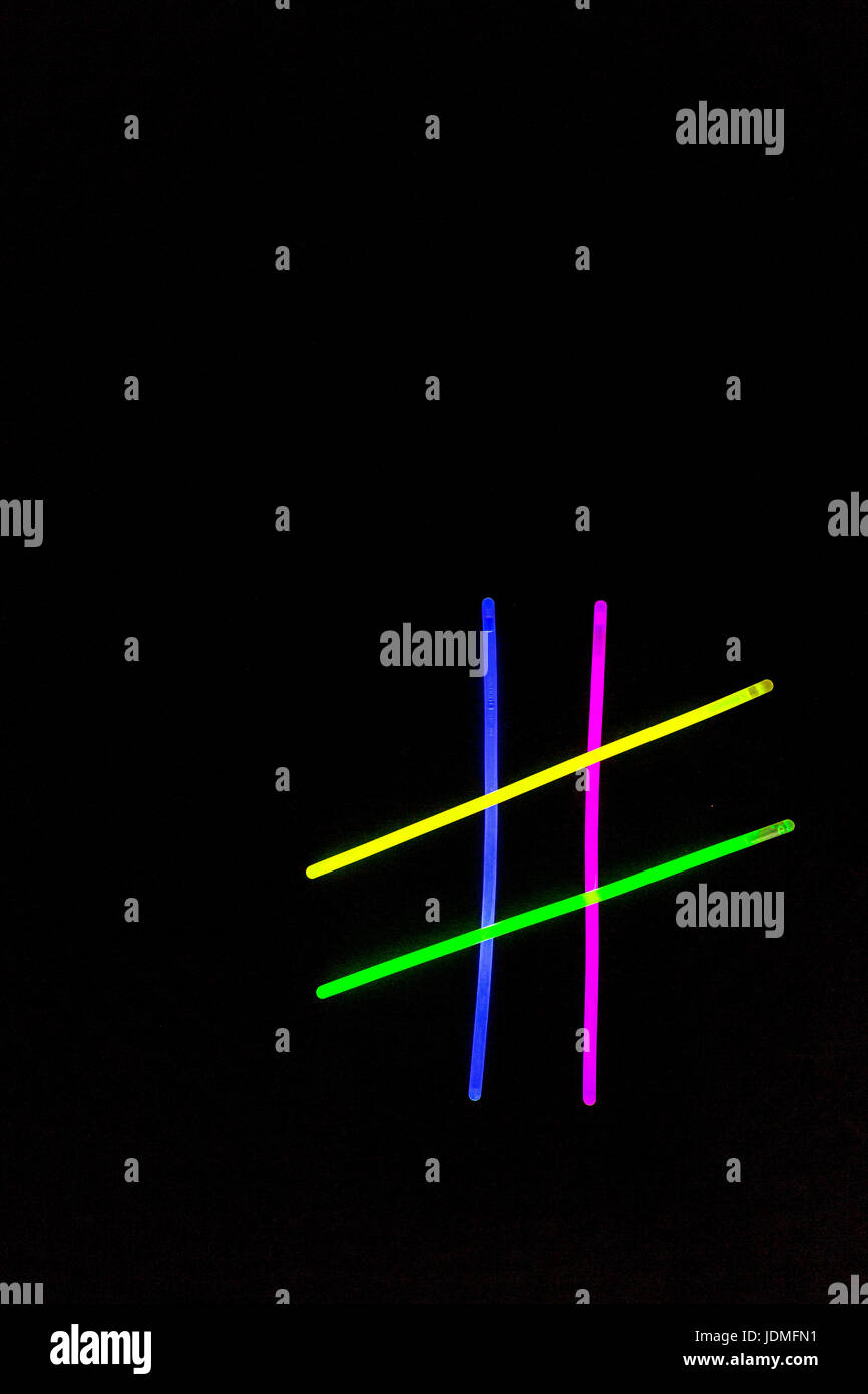 Glow sticks neon light fluorescent on back background. variation of ...