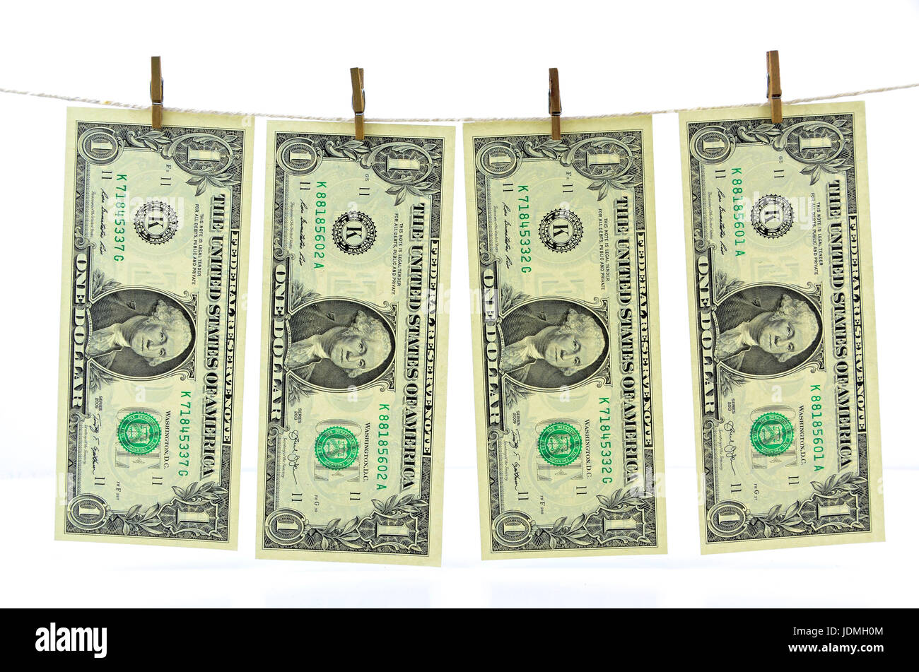 Dirty money hanging from a clothesline isolated on white Stock Photo ...