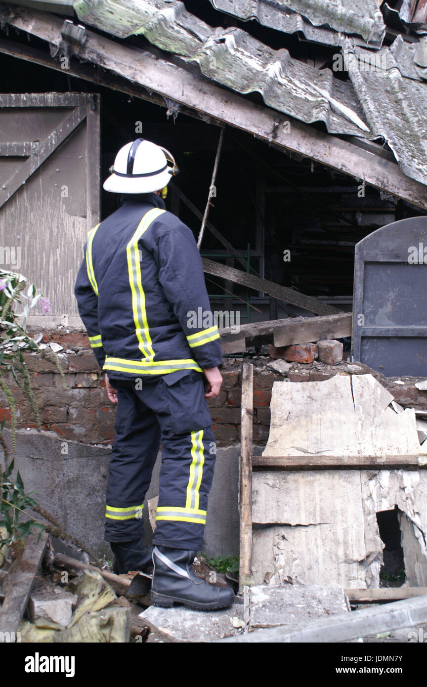 fire fighter at building collapse, emergency rescue Stock Photo - Alamy