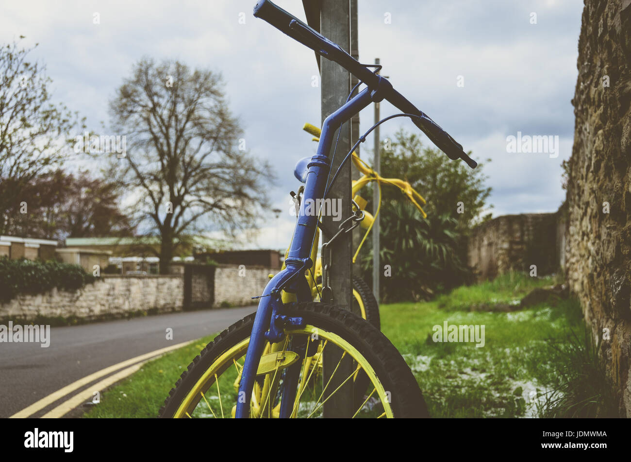 Old retro bike painted with yellow color. Vintage effect Stock Photo ...