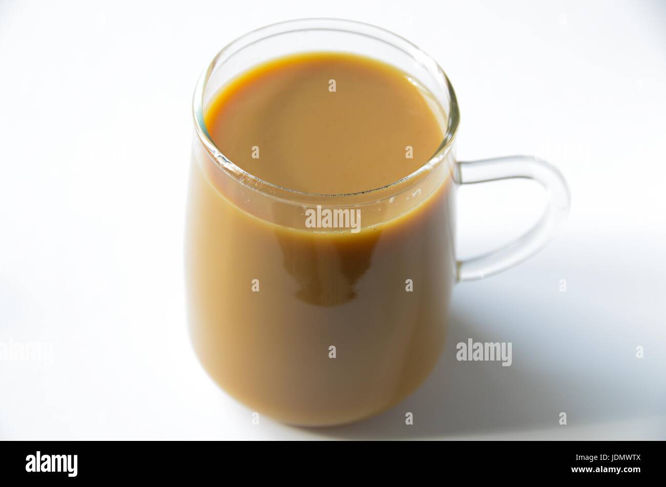 A white coffee glass full of coffee on a white background Stock Photo ...