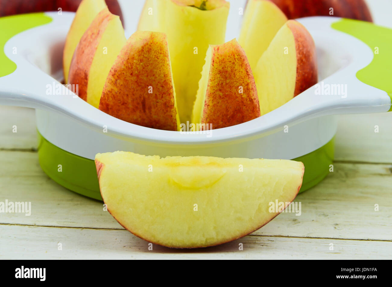 Apple cutter, apple slicer on white board Stock Photo - Alamy