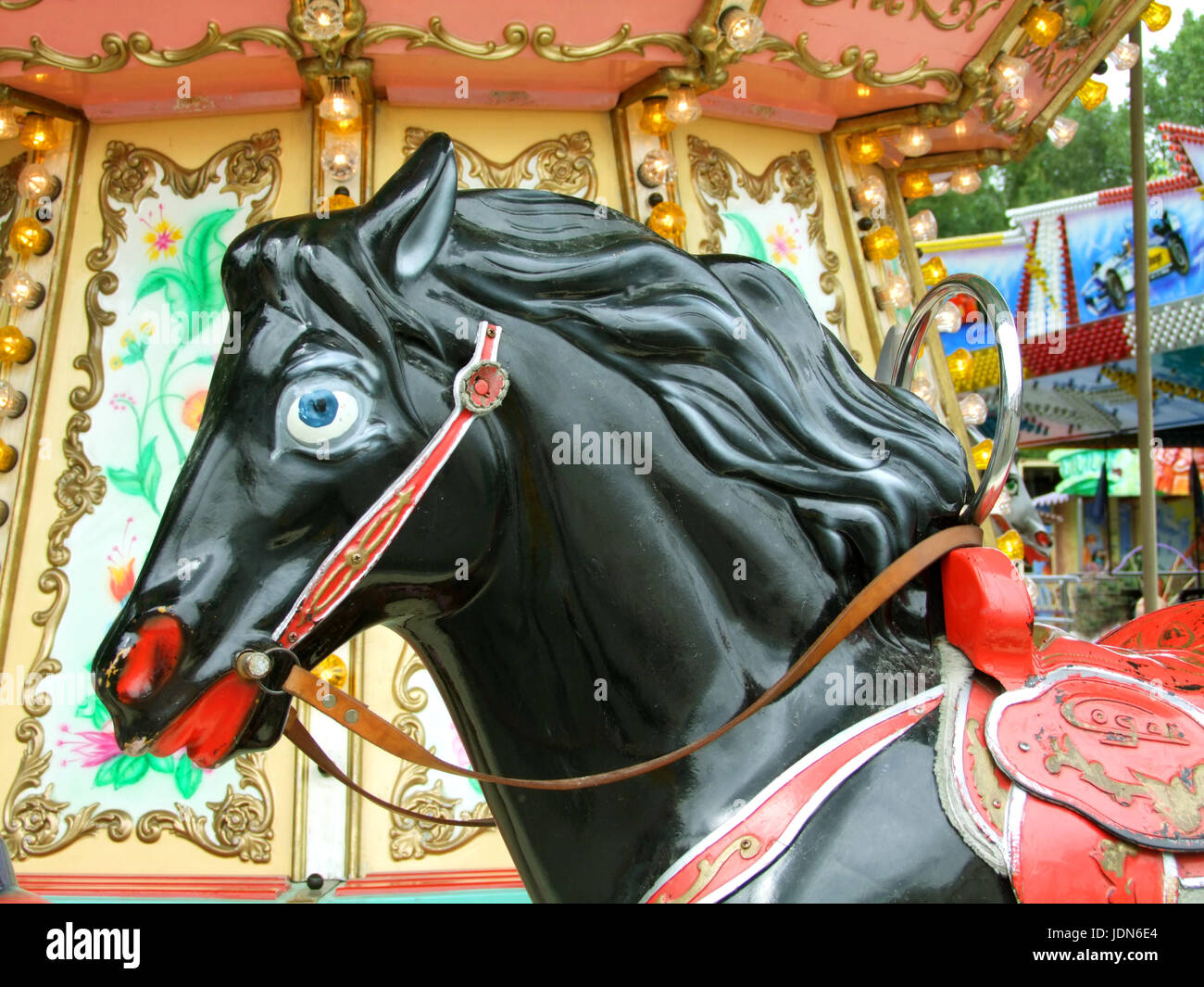 Black carnival carousel Horse. Shot outdoor Stock Photo - Alamy