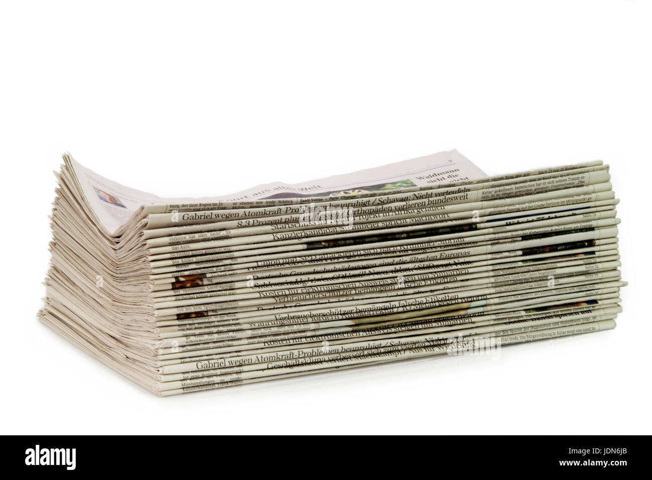Newspaper stack on white background Stock Photo - Alamy