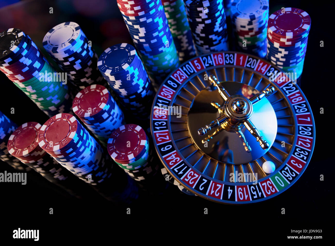 Casino blurred background. Roulette and stacks of chips Stock Photo - Alamy