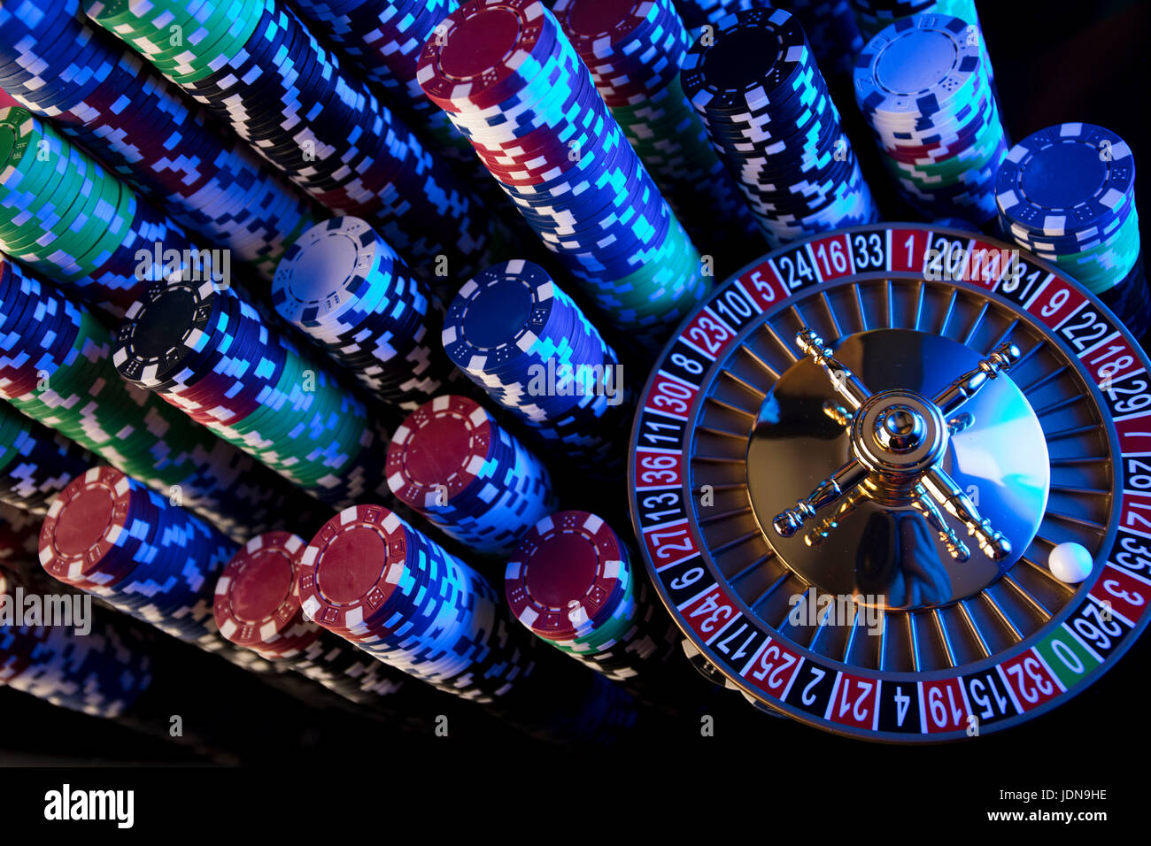 Casino blurred background. Roulette and stacks of chips Stock Photo - Alamy