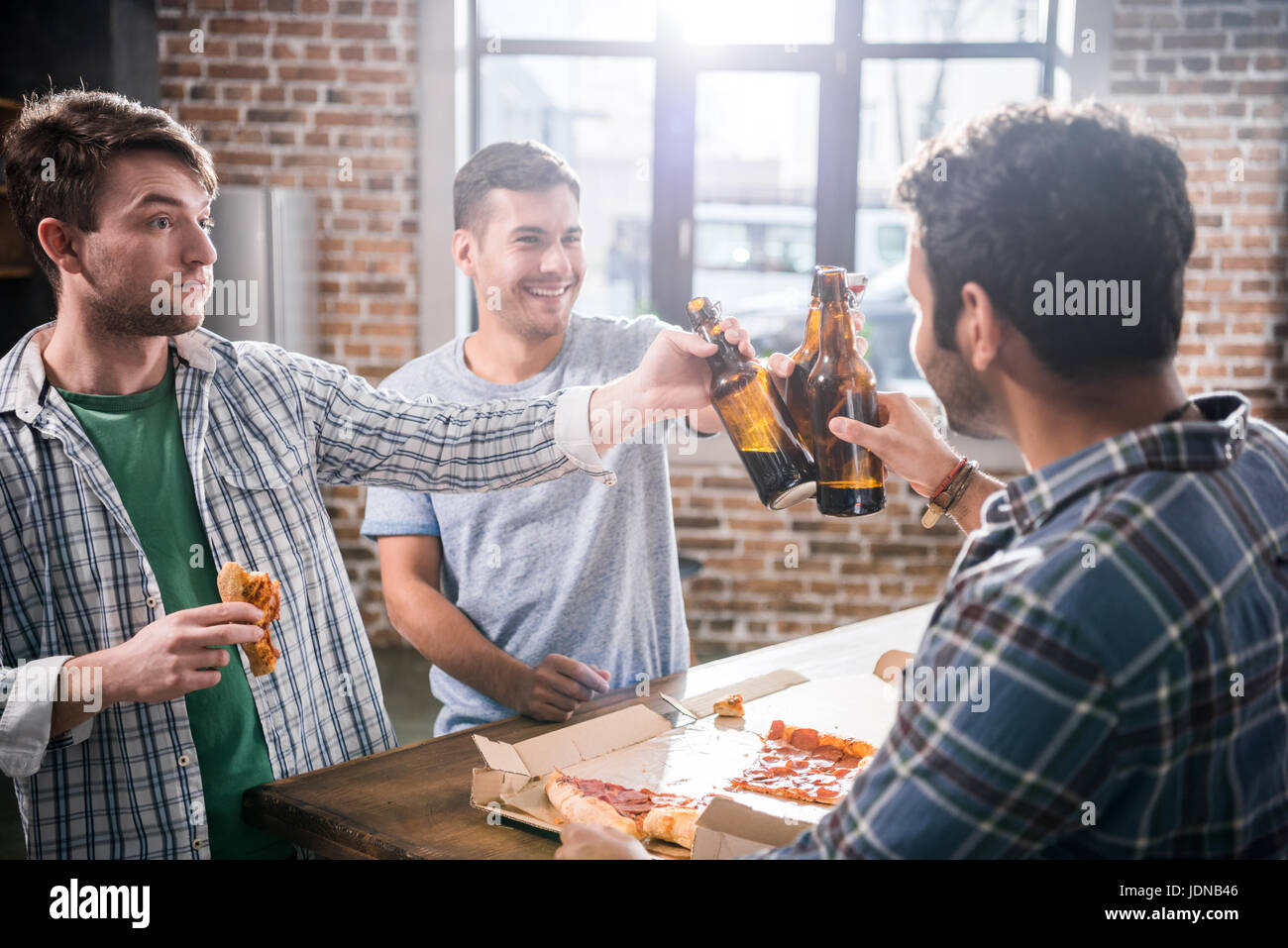 Young people drinking alcohol eating hi-res stock photography and ...