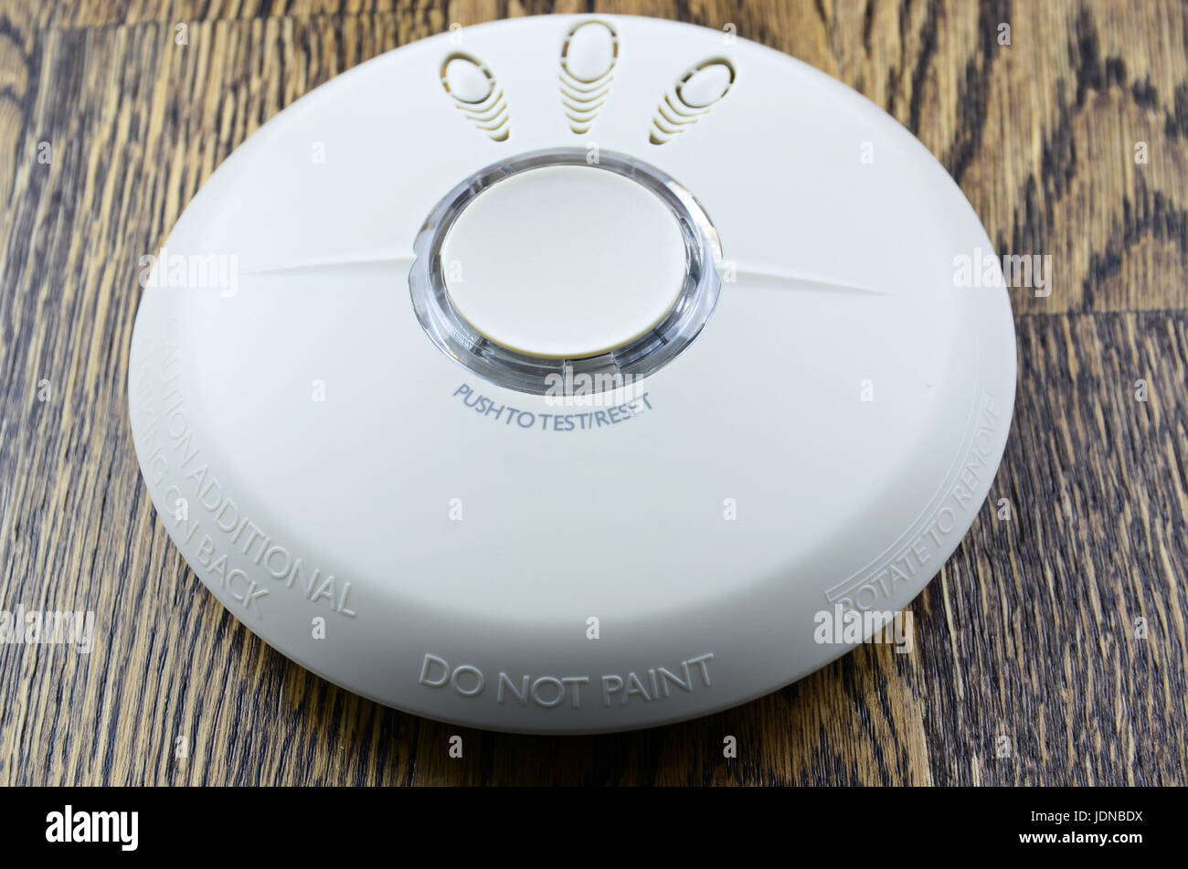 Smoke, fire detector on wooden background Stock Photo - Alamy