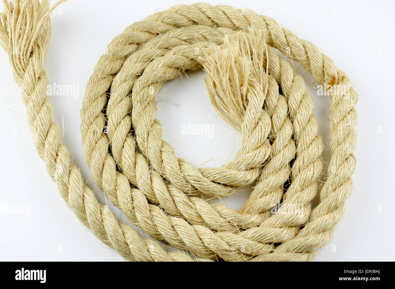 Rope rolled up on a white background. seamless Stock Photo - Alamy